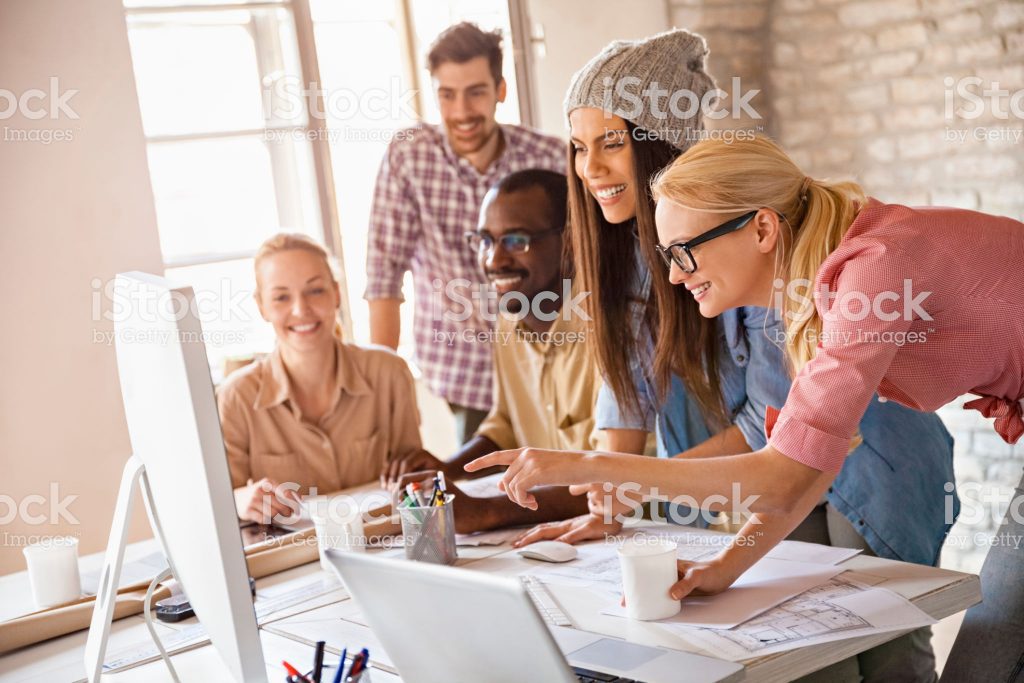 Close up of a coworkers working together - Caraniche